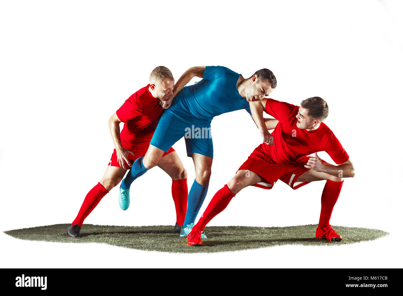 Football players tackling for the ball over white background Stock ...