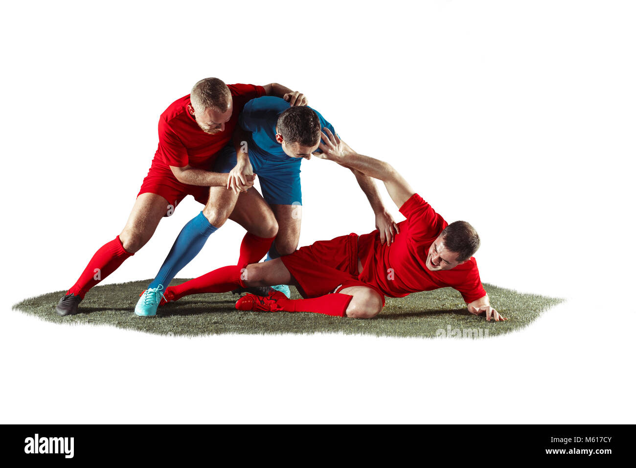 Football players tackling for the ball over white background Stock ...