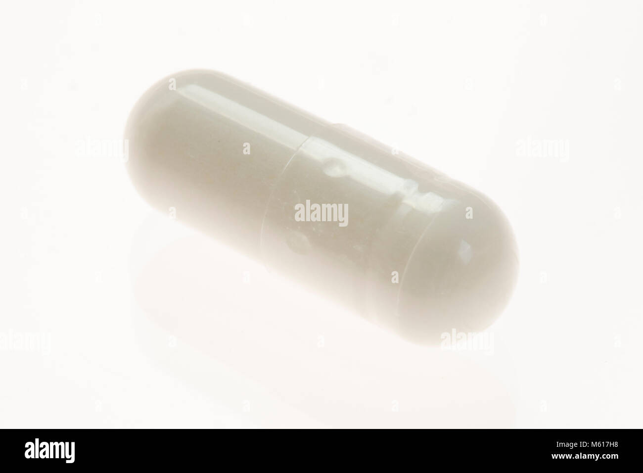 white capsule medicine for health isolated on white background Stock ...