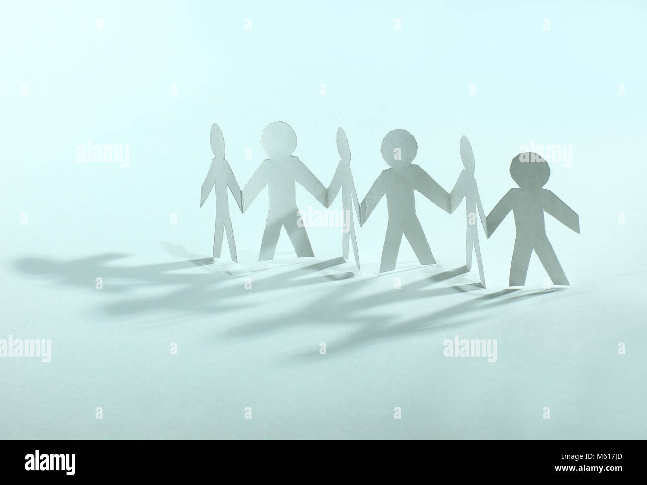 concept of teamwork.team paper men standing Stock Photo - Alamy