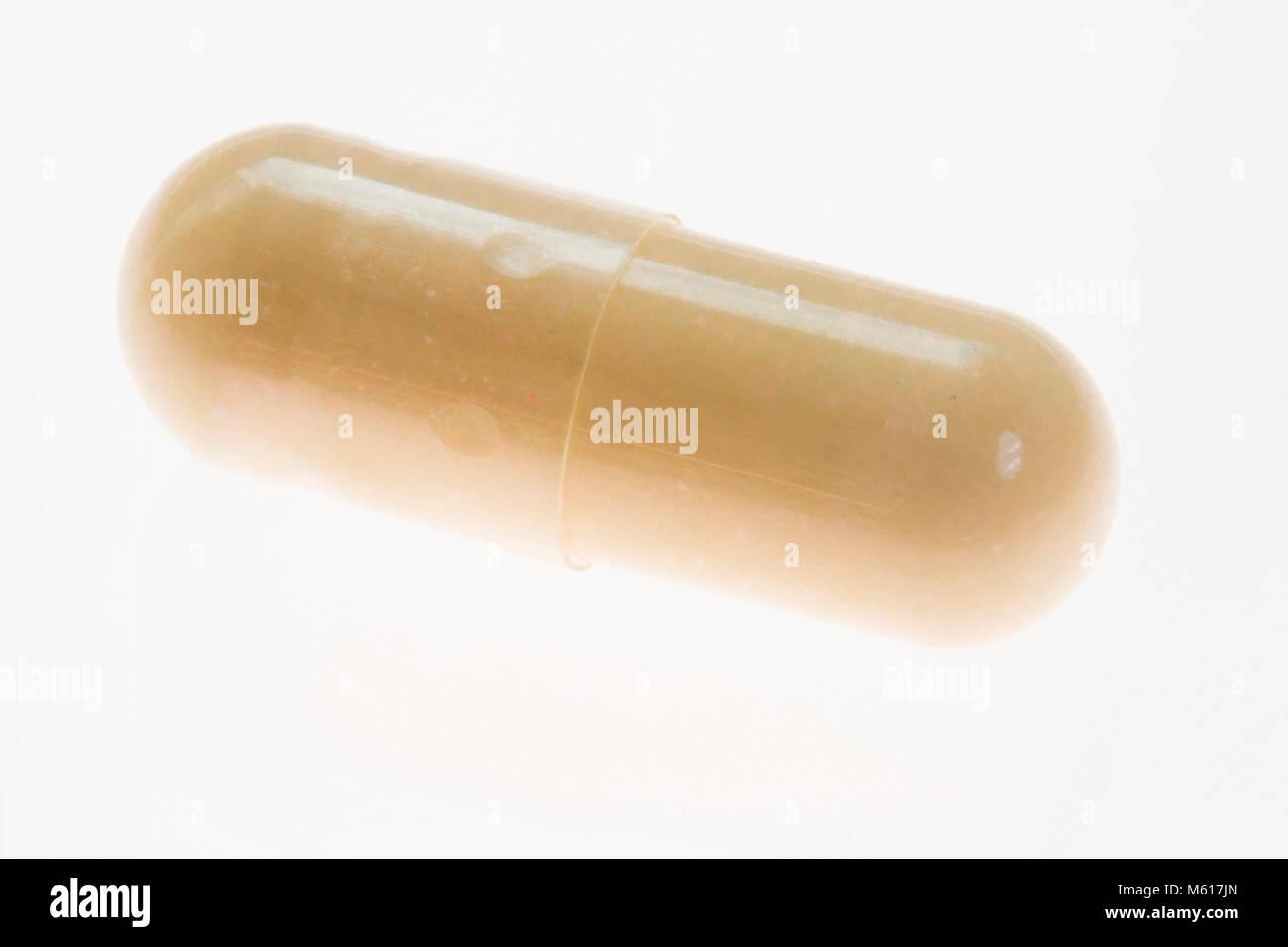 yellow capsule medicine for health isolated on white background Stock ...