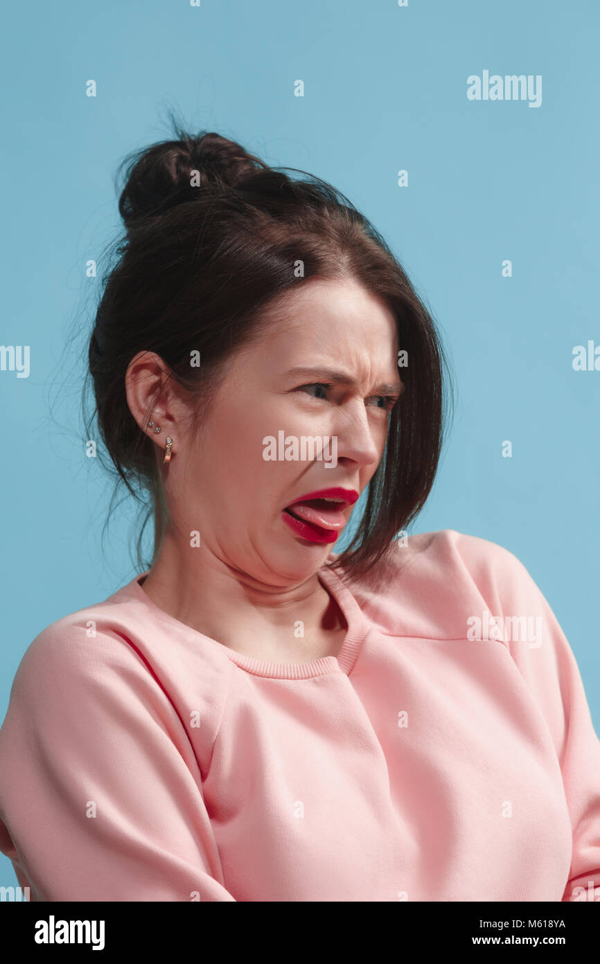 Young Woman With Disgusted Expression Repulsing Something Isolated On