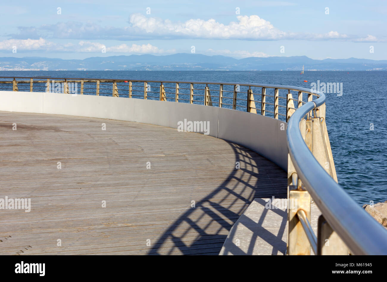 A curve shaped terrace by the sea Stock Photo - Alamy