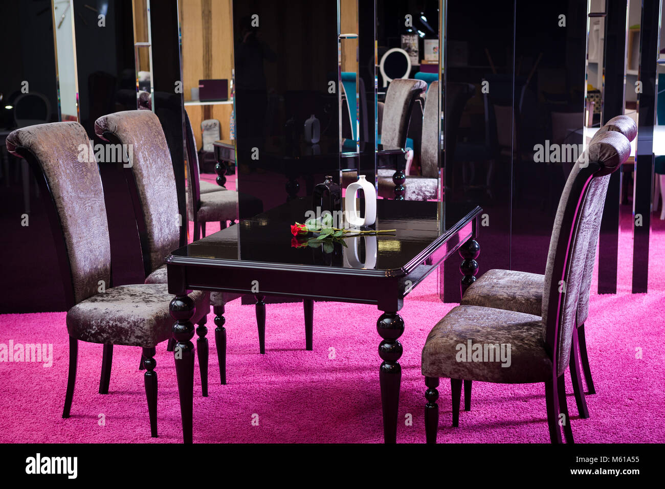 Shop, sale of furniture on the sales area. Dining table is black glossy ...