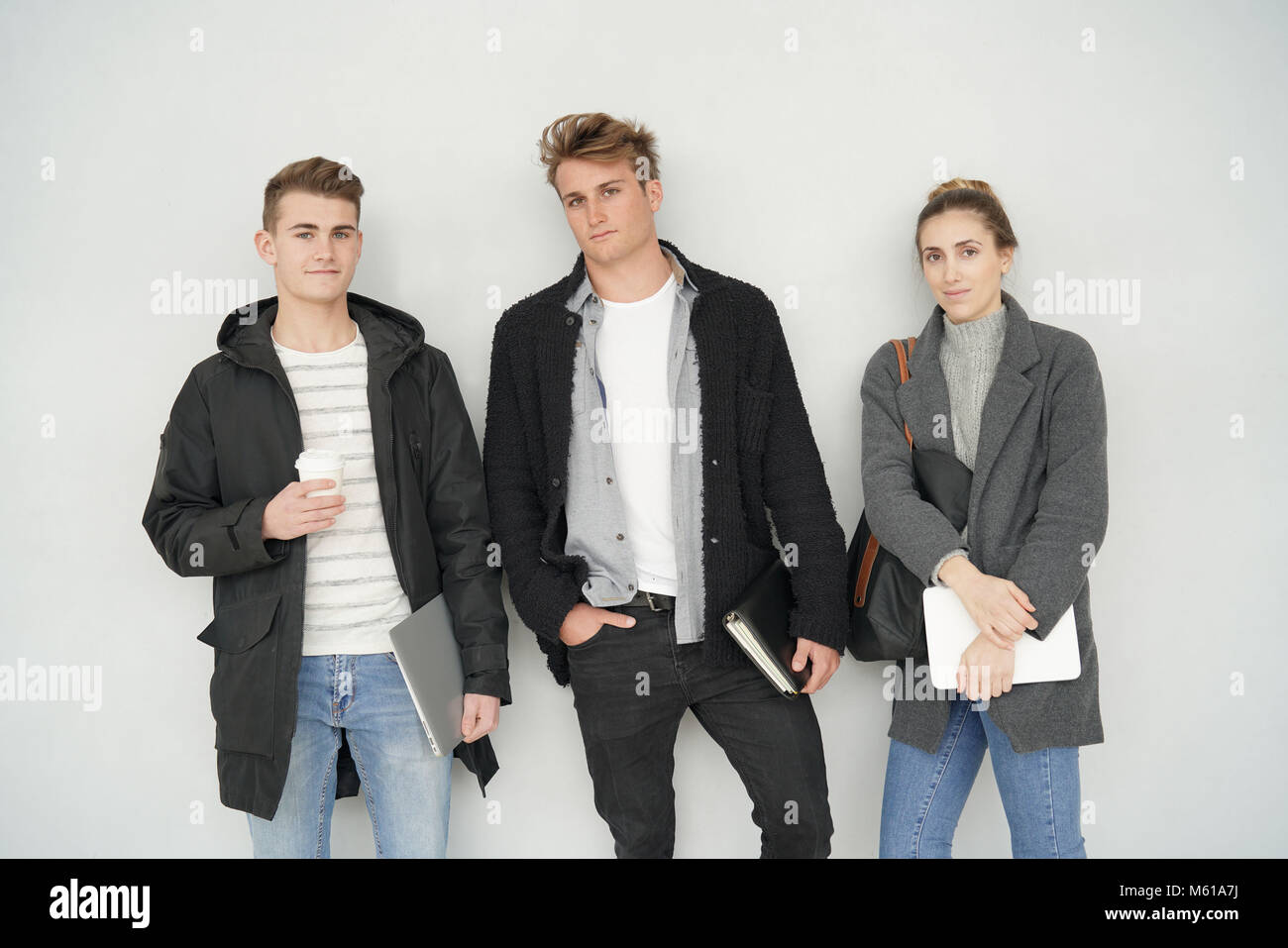 Students standing in college hall, isolated Stock Photo - Alamy