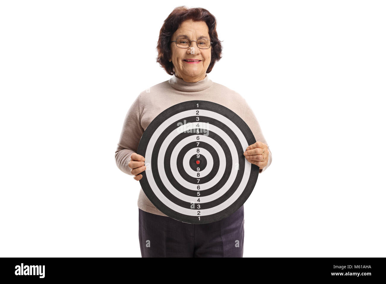 Elderly woman holding a target isolated on white background Stock Photo ...