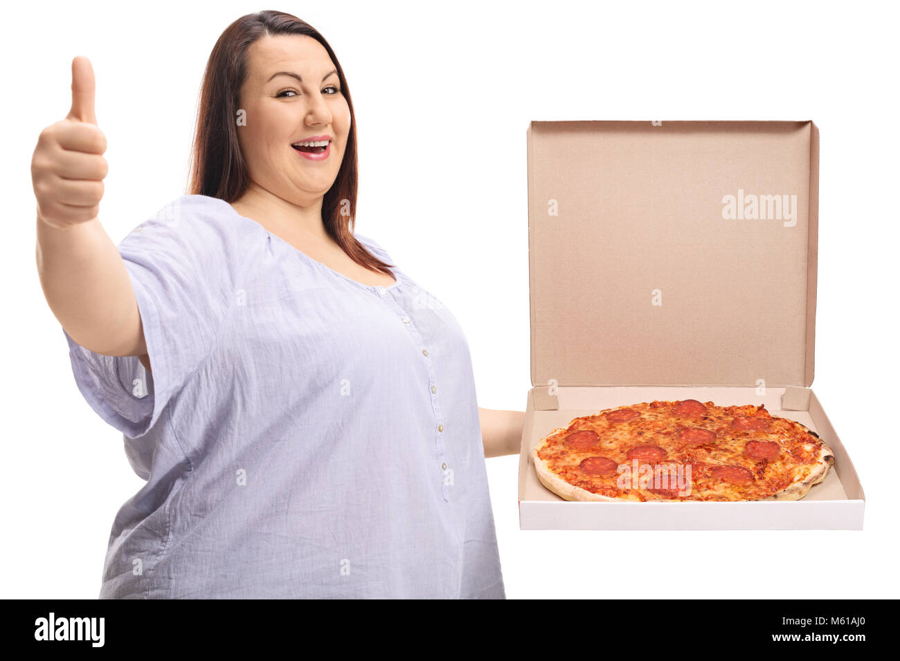 Overweight woman holding a pizza box and making a thumb up sign ...
