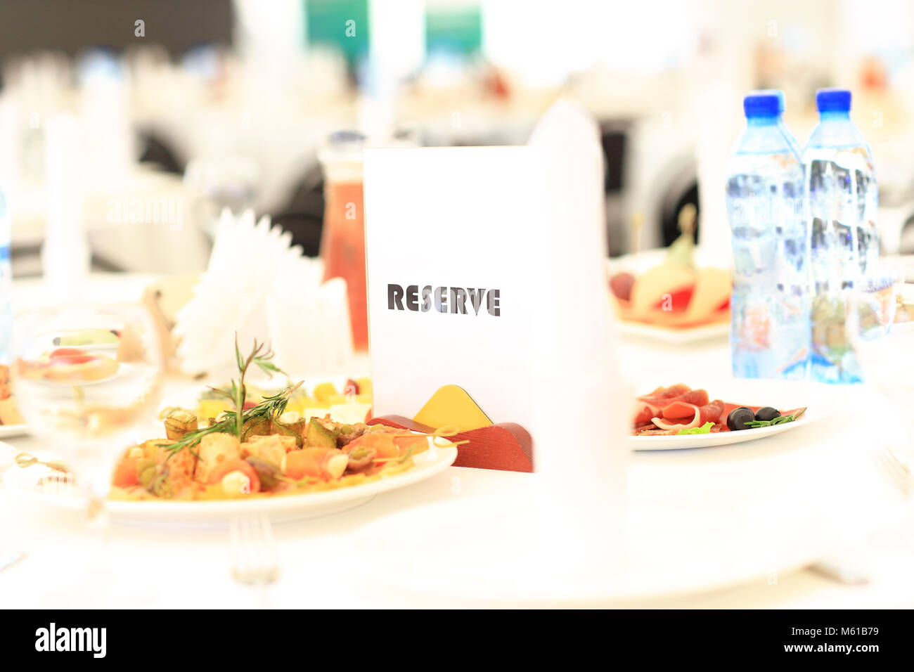 catering table set service with silverware Stock Photo - Alamy