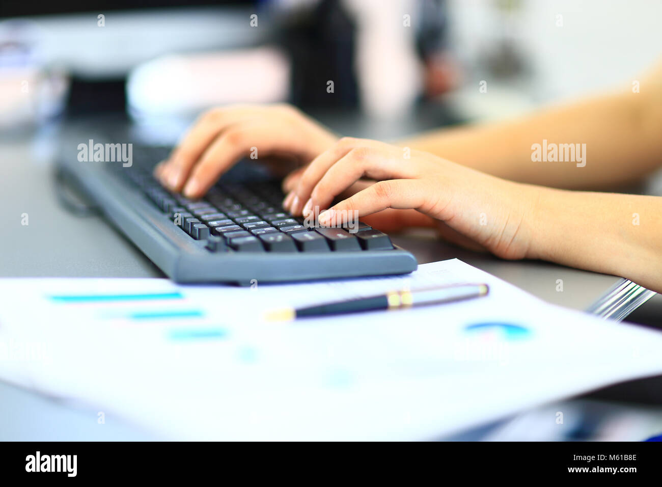 Close-up shot of a female learner typing Stock Photo - Alamy