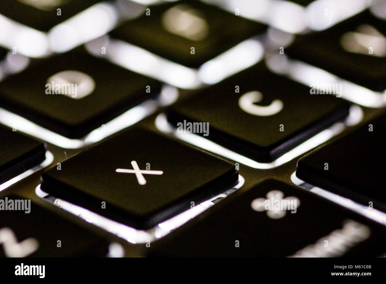 macro photograph of keyboard keys (x and c), backlit, black keys Stock ...