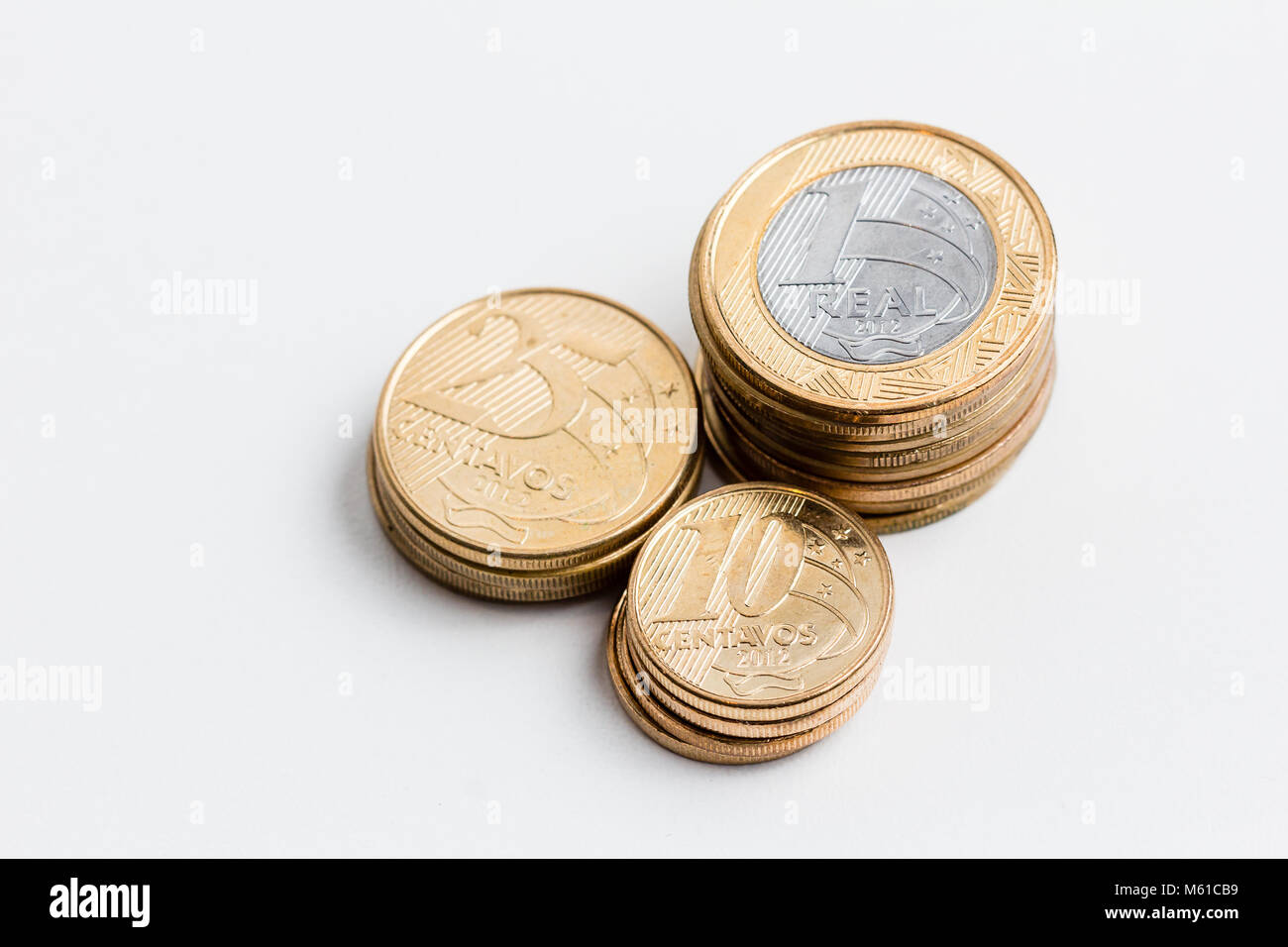 brazilian real coins in white background, gold and silver colors Stock ...