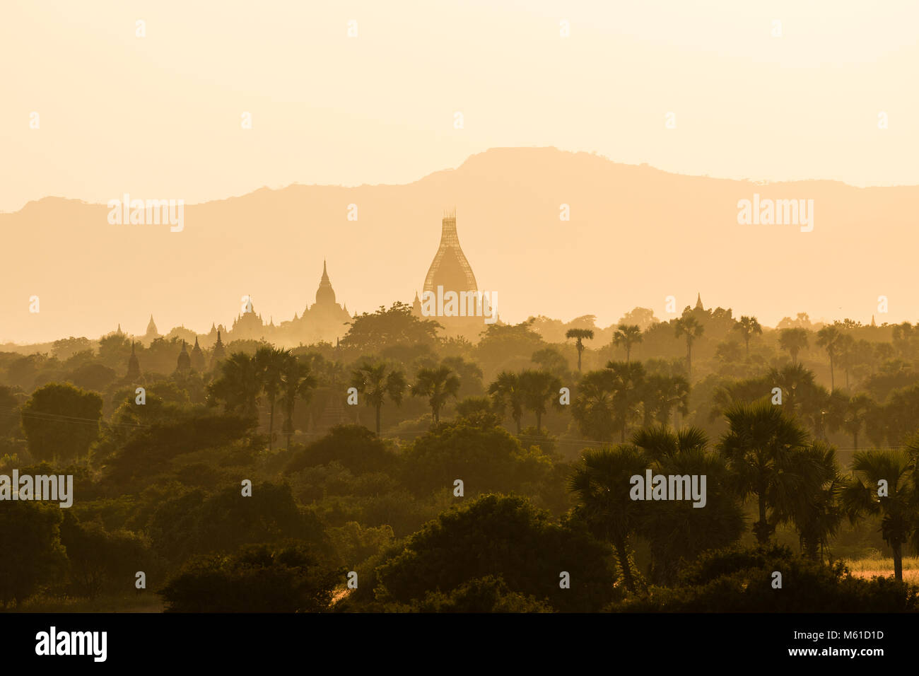 Landscape with temples and pagodas in the magic evening light in Bagan ...