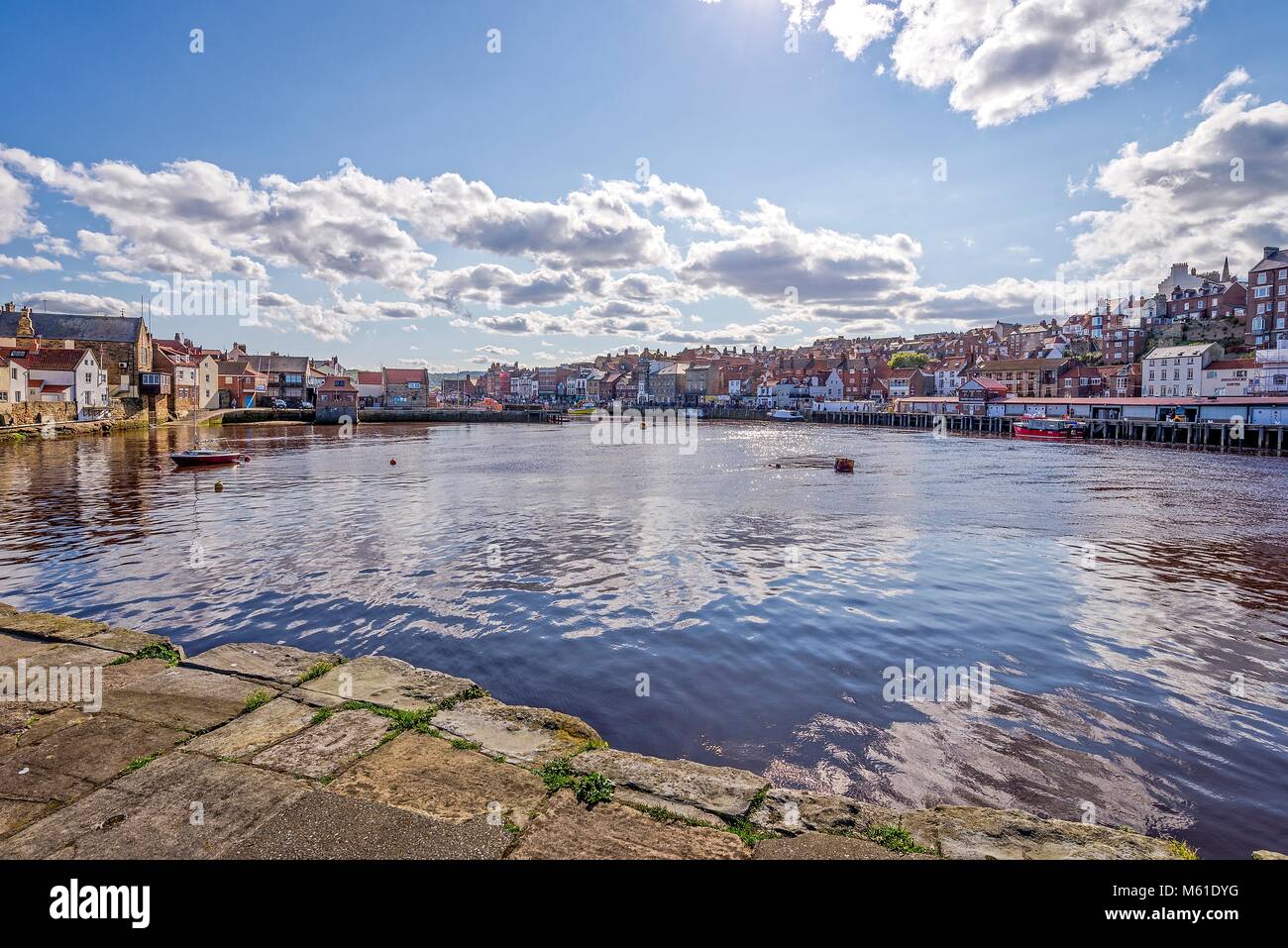 Inwards view of the harbour at Whitby with various buildings clustered ...