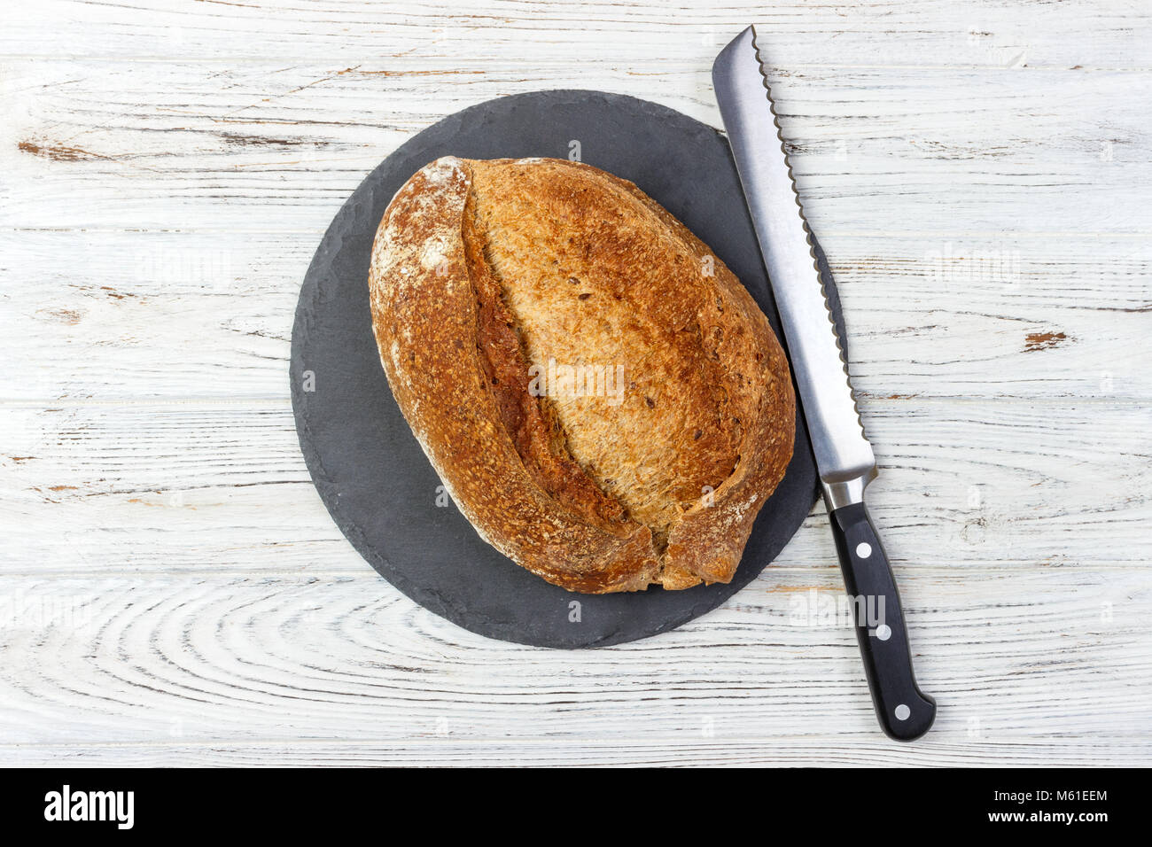 bread loaf on Black Slate Board. Top view Stock Photo - Alamy