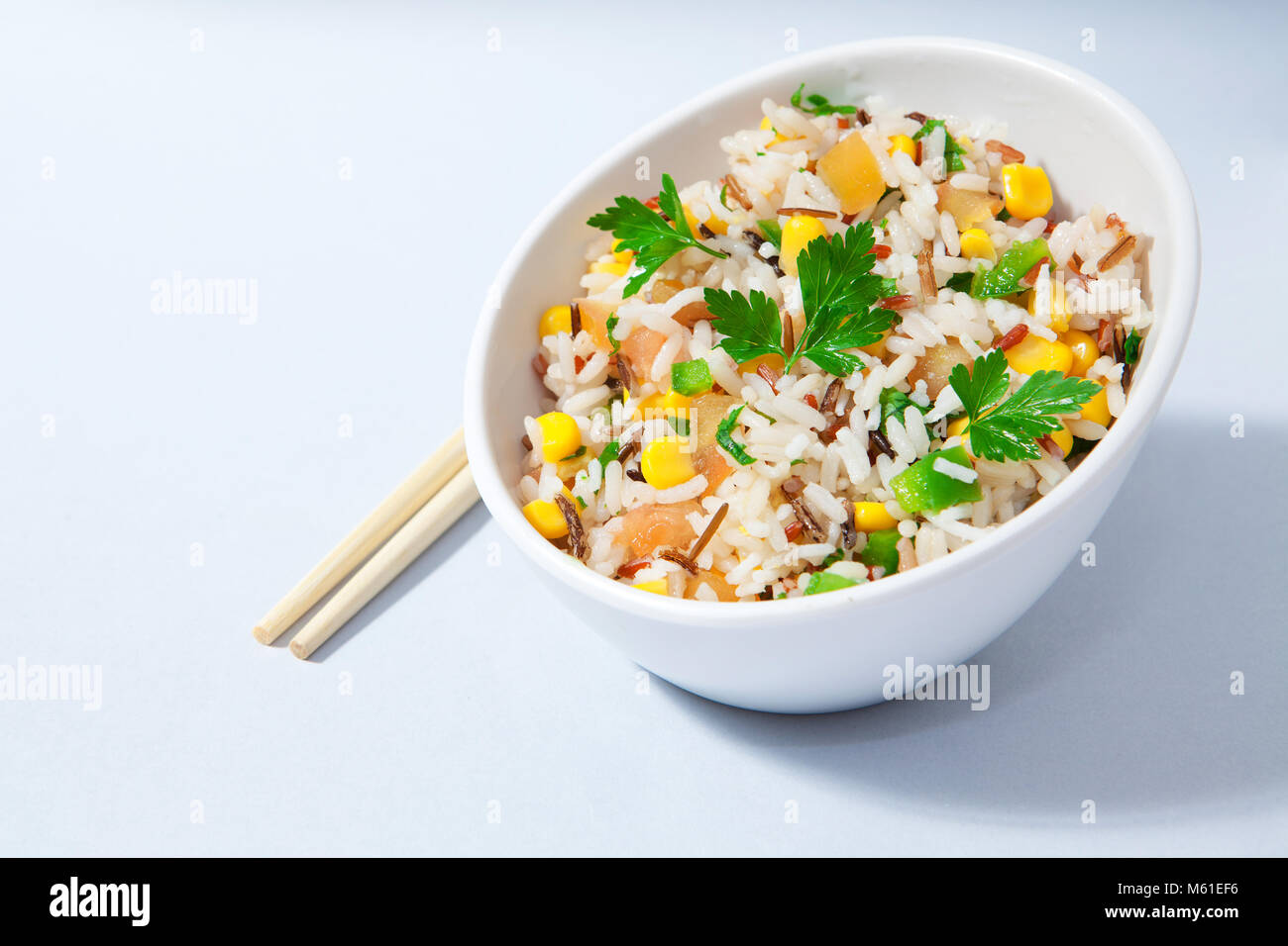 healthy asorted rice salad on white bowl Stock Photo - Alamy