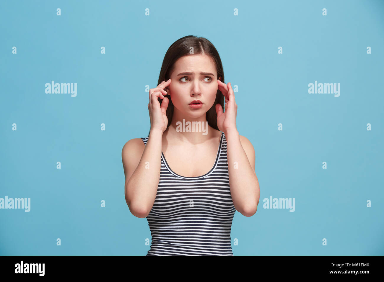 Let me think. Doubtful pensive woman with thoughtful expression making ...