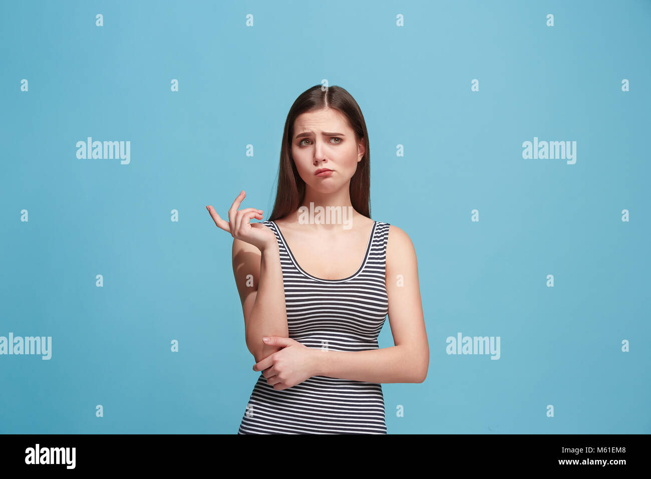 Let me think. Doubtful pensive woman with thoughtful expression making ...