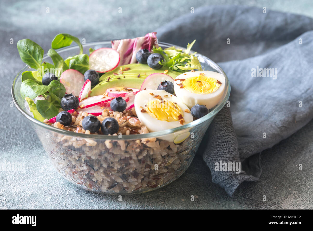 Bowl of wild rice with avocado, egg and lettuce Stock Photo - Alamy