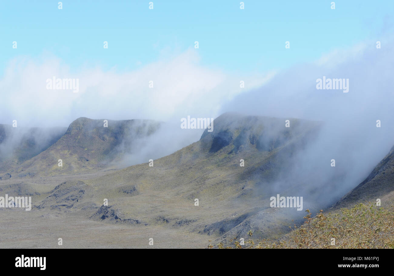 Cloud pours over the rim of Sierra Negra Volcano. Isabela, Galapagos ...