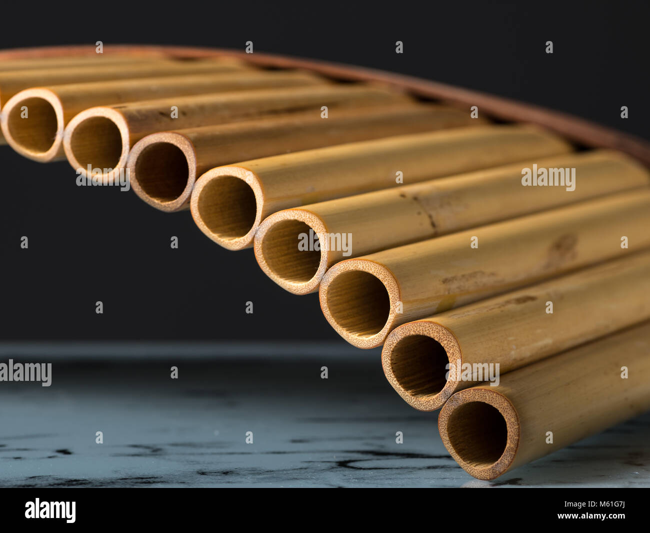 Detailed closeup view of a pan flute, dark background Stock Photo - Alamy