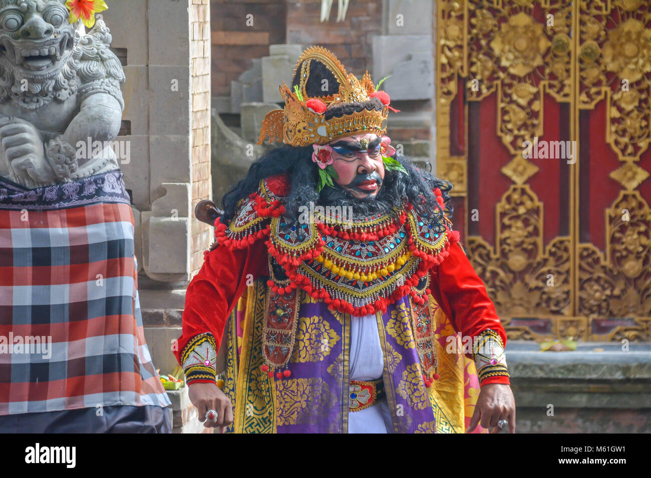 Balinese locals performing Barong, a mythical lion-like creature at a ...