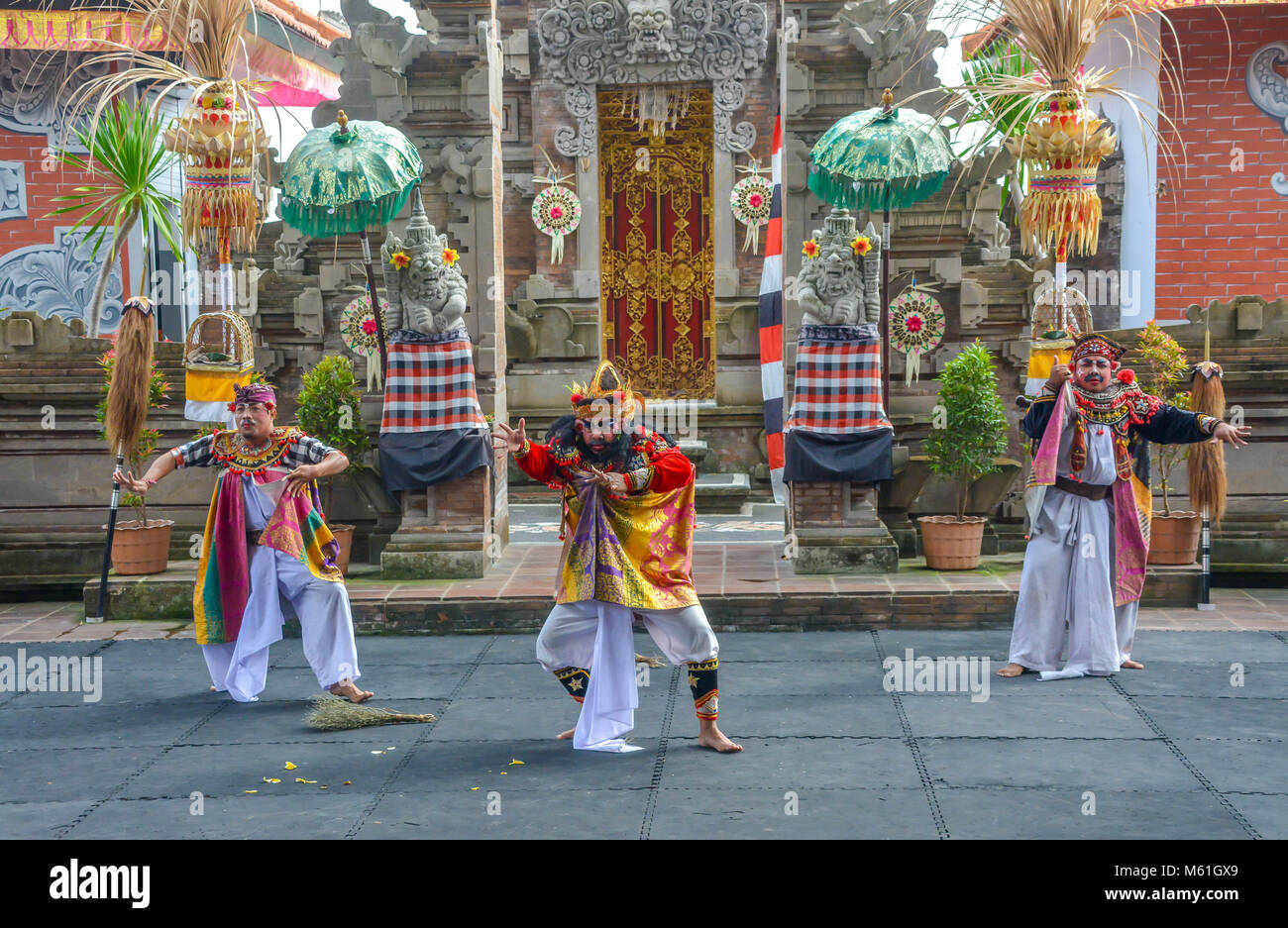 Balinese locals performing Barong, a mythical lion-like creature at a ...