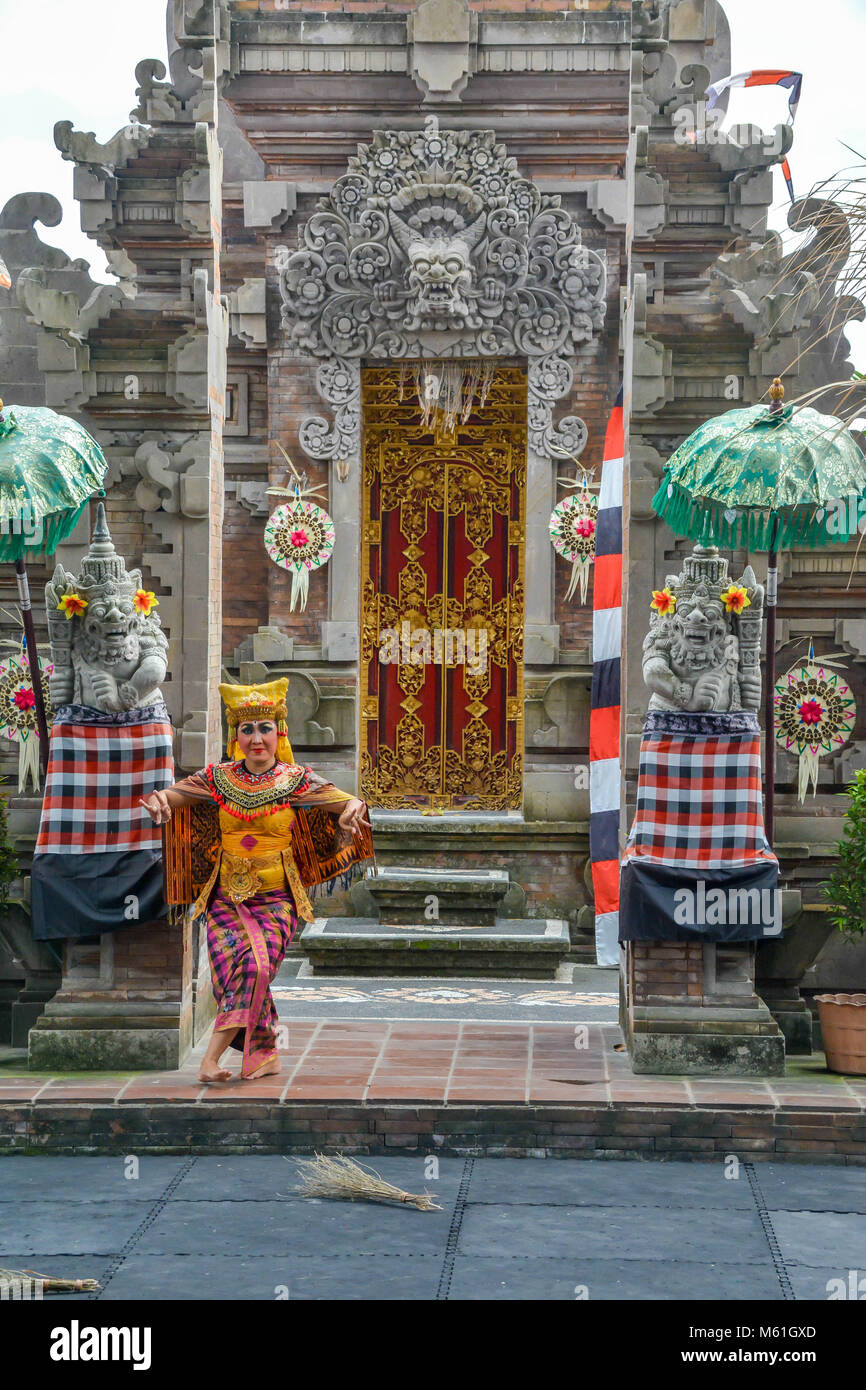 Balinese locals performing Barong, a mythical lion-like creature at a ...
