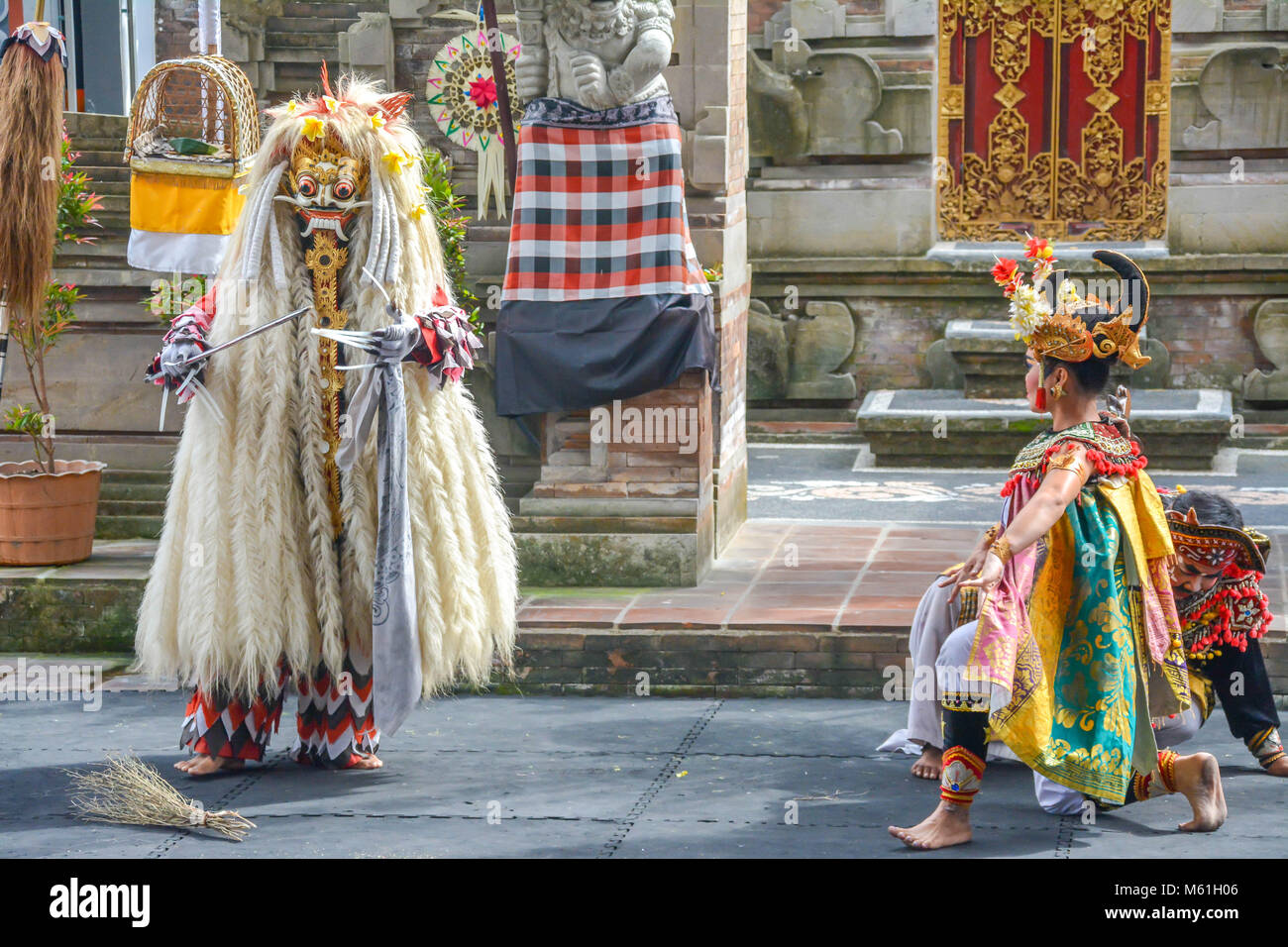 Balinese locals performing Barong, a mythical lion-like creature at a ...