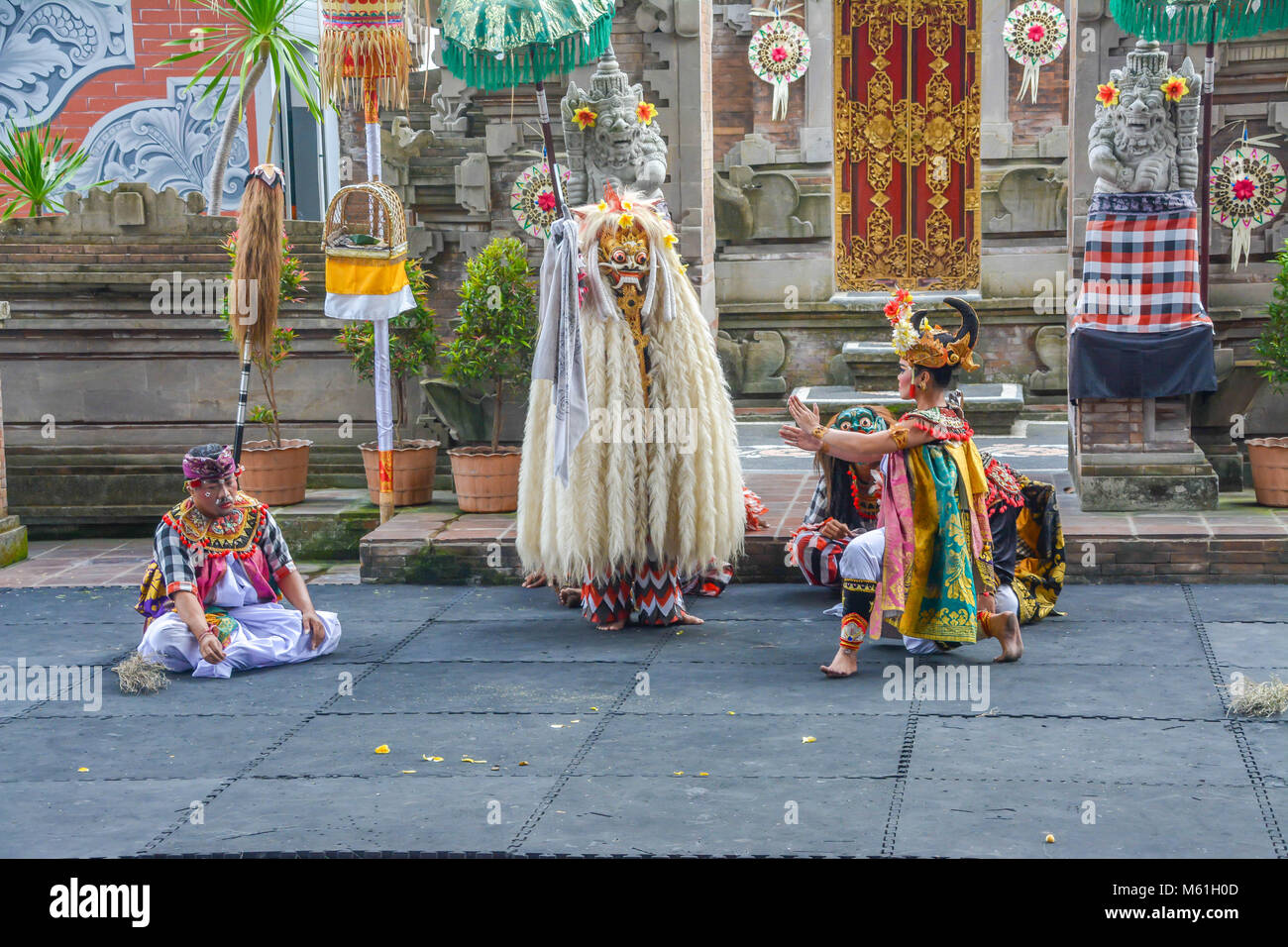 Balinese locals performing Barong, a mythical lion-like creature at a ...
