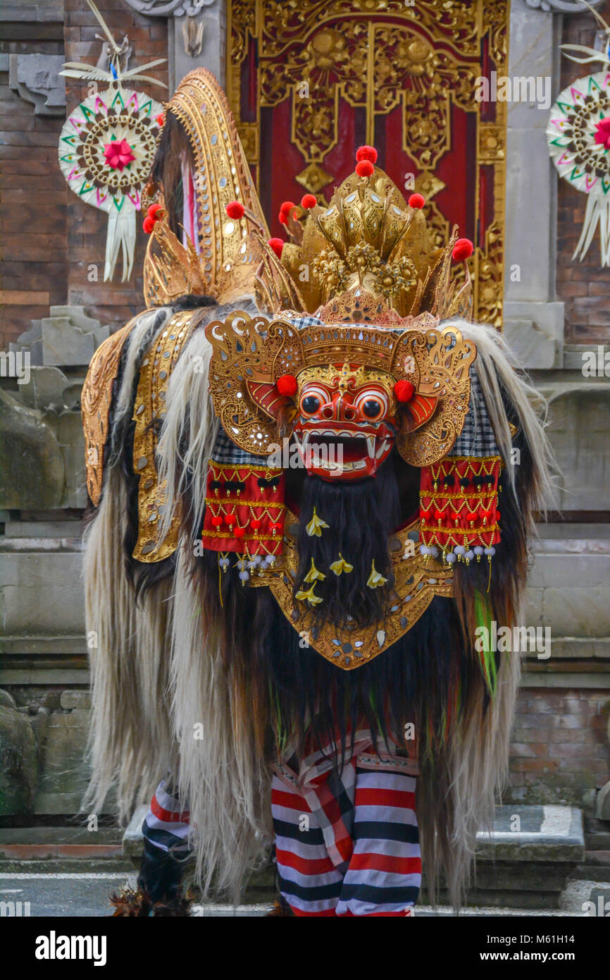 Balinese locals performing Barong, a mythical lion-like creature at a ...