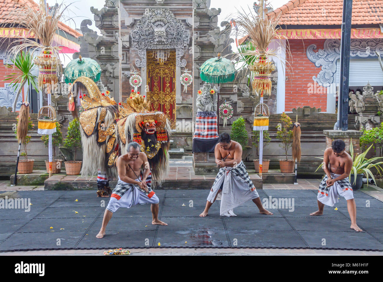 Balinese locals performing Barong, a mythical lion-like creature at a ...