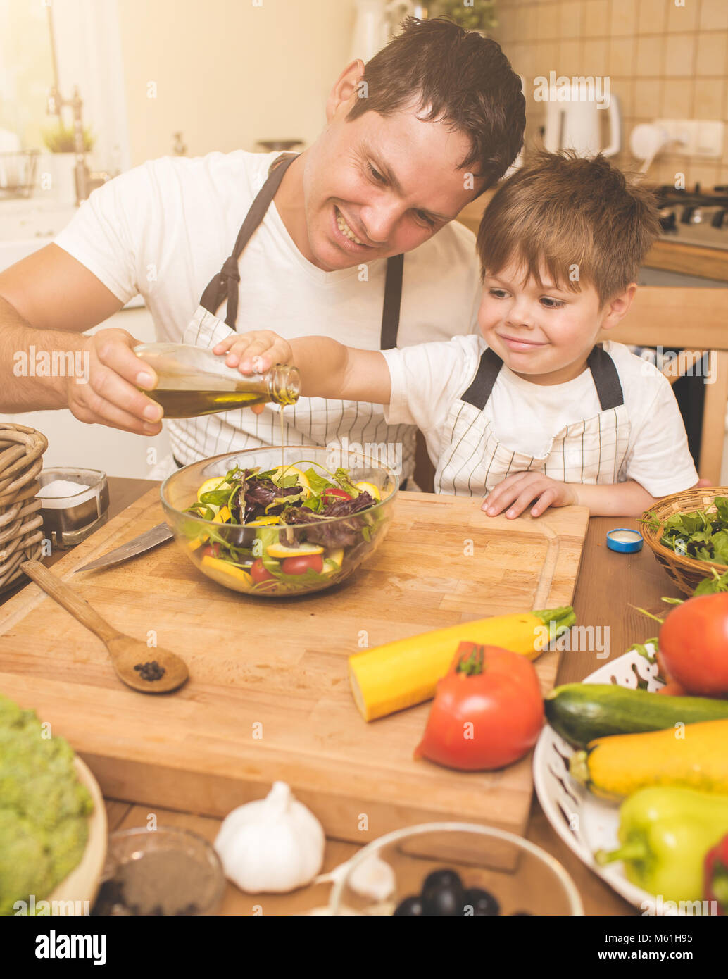 Father is cooking with his son Stock Photo - Alamy