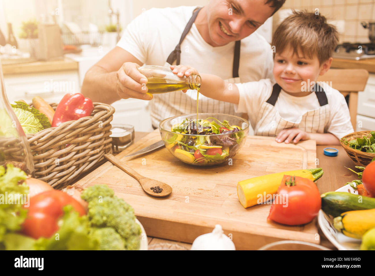 Father is cooking with his son Stock Photo - Alamy