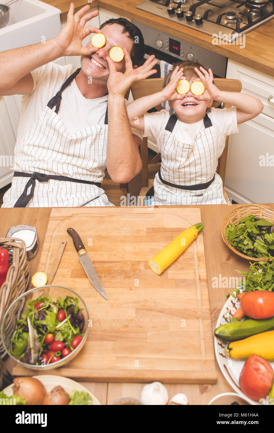 Father is cooking with his son Stock Photo - Alamy