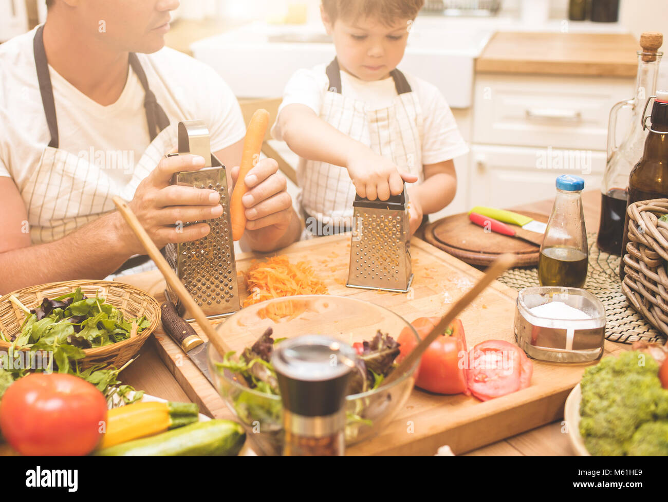 Father is cooking with his son Stock Photo - Alamy