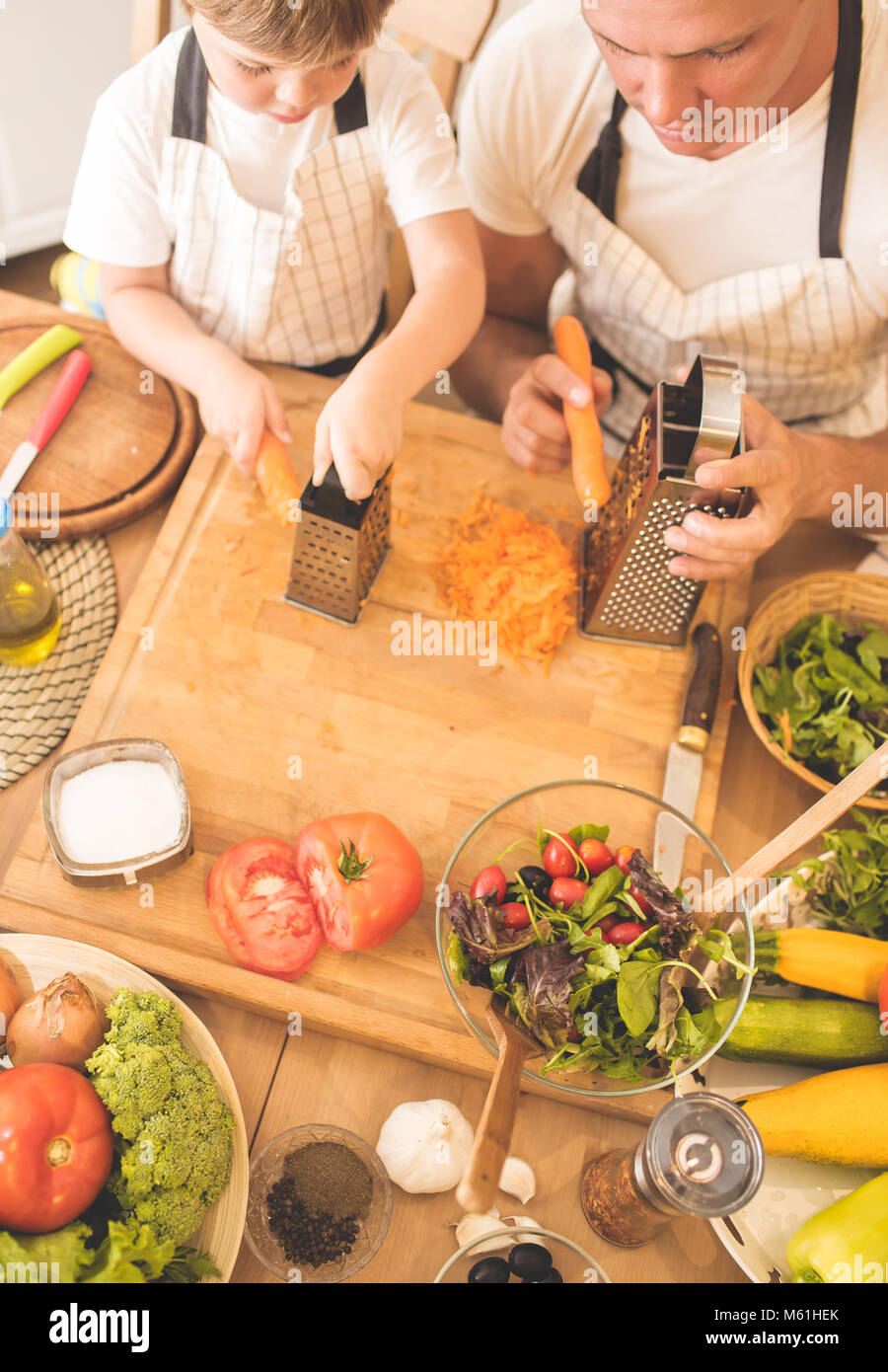 Father is cooking with his son Stock Photo - Alamy