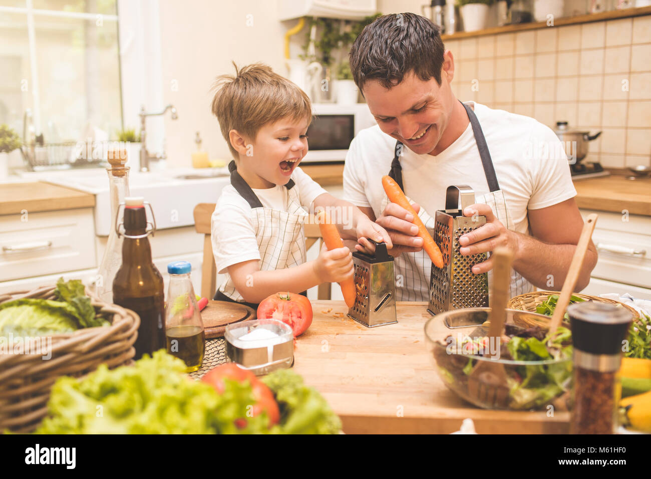 Father is cooking with his son Stock Photo - Alamy
