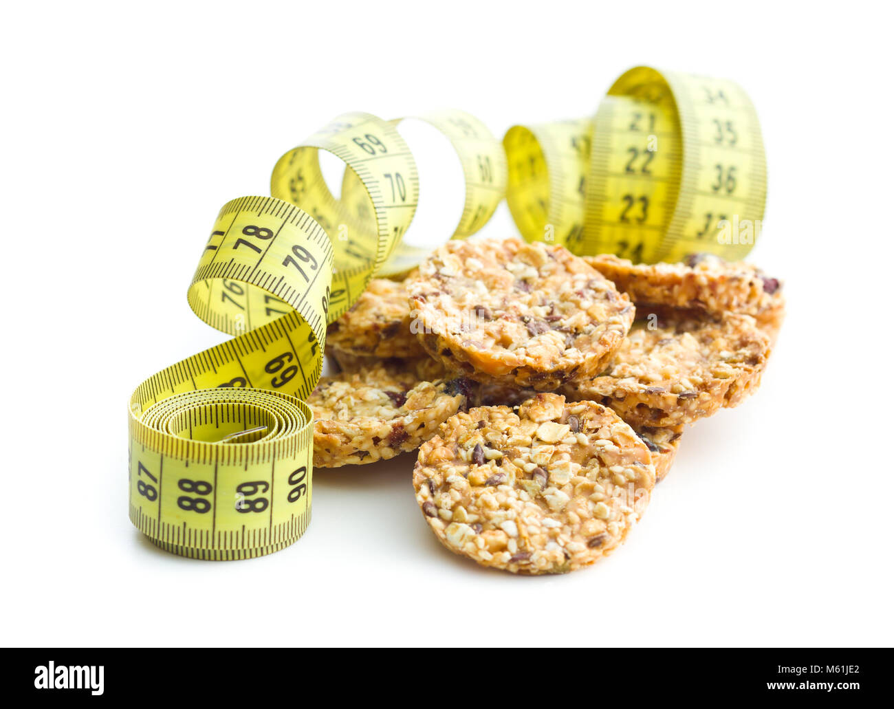 Oatmeal cookies, granola cookies and measuring tape isolated on white ...