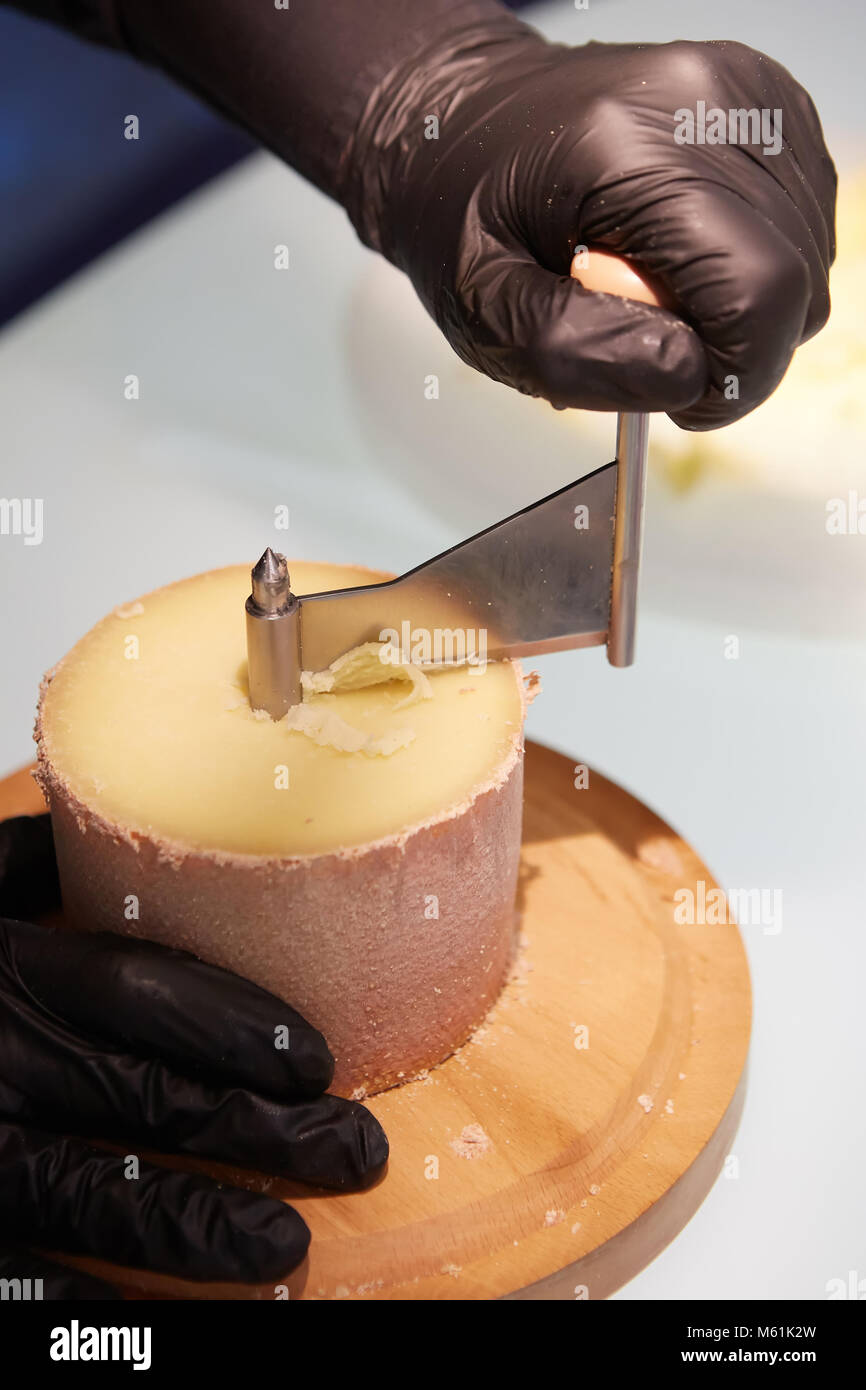 Special cheese knives. The girolle scraper. Making cheese shaving on ...