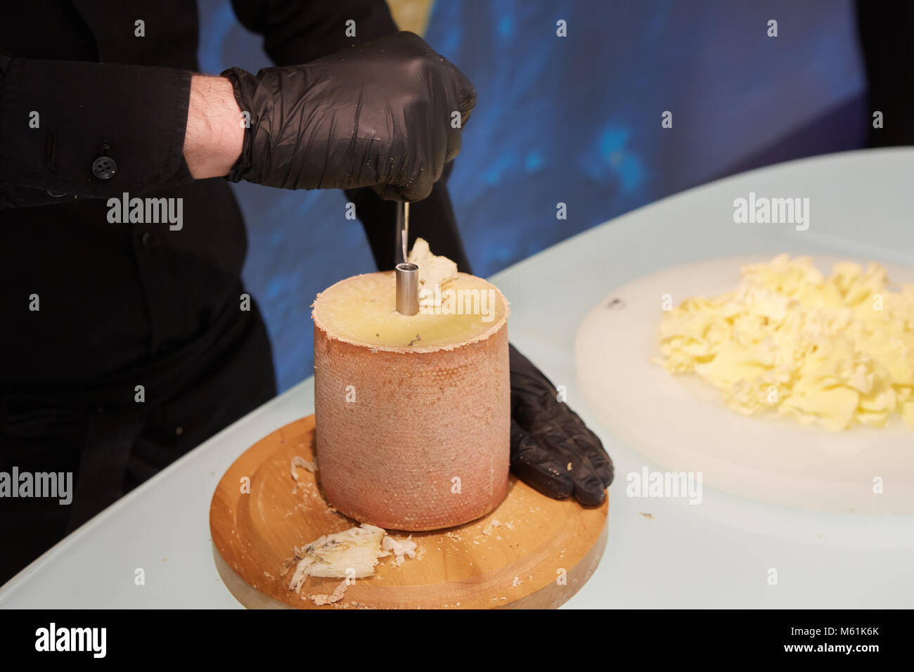 Special cheese knives. The girolle scraper. Making cheese shaving on ...