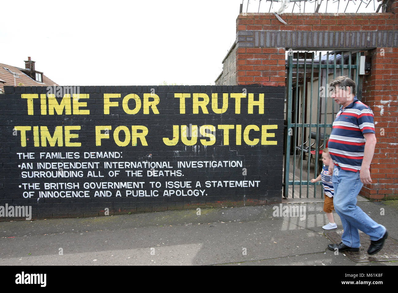 Murals dedicated to the 1971 Ballymurphy Massacre seen on a wall in ...