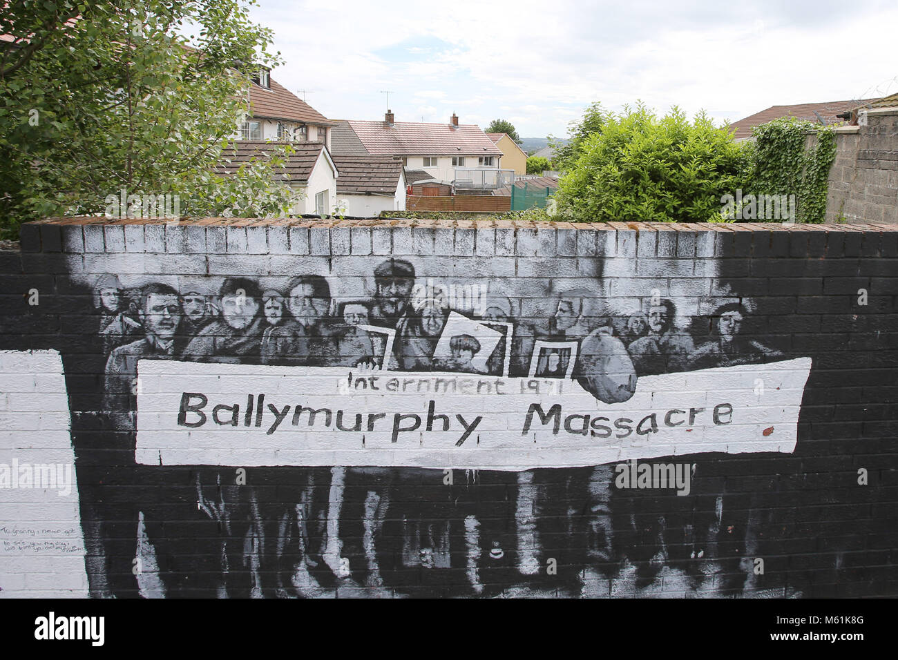 Murals dedicated to the 1971 Ballymurphy Massacre seen on a wall in ...