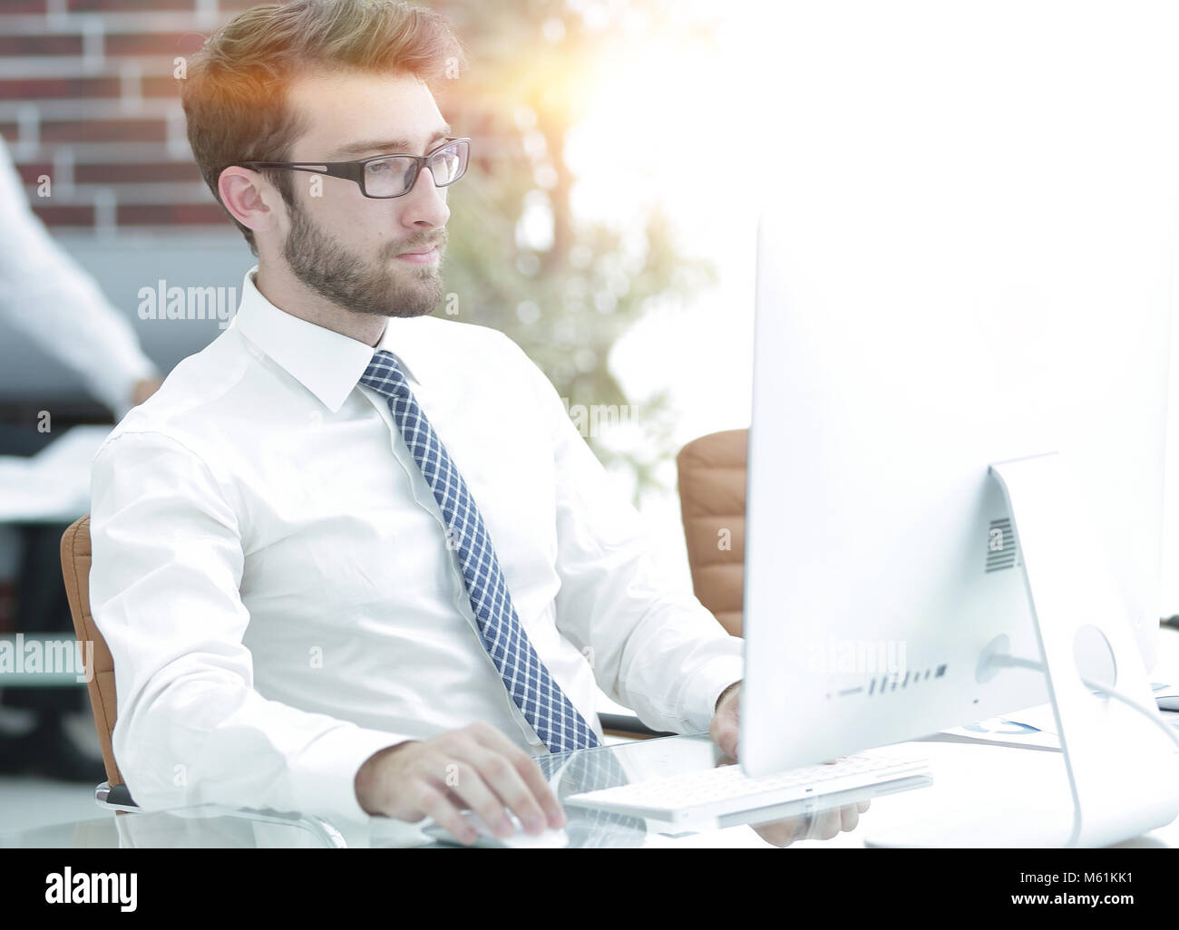 Manager works on a computer Stock Photo - Alamy