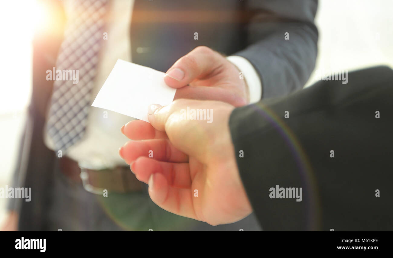 Exchange business card for first time meet Stock Photo - Alamy