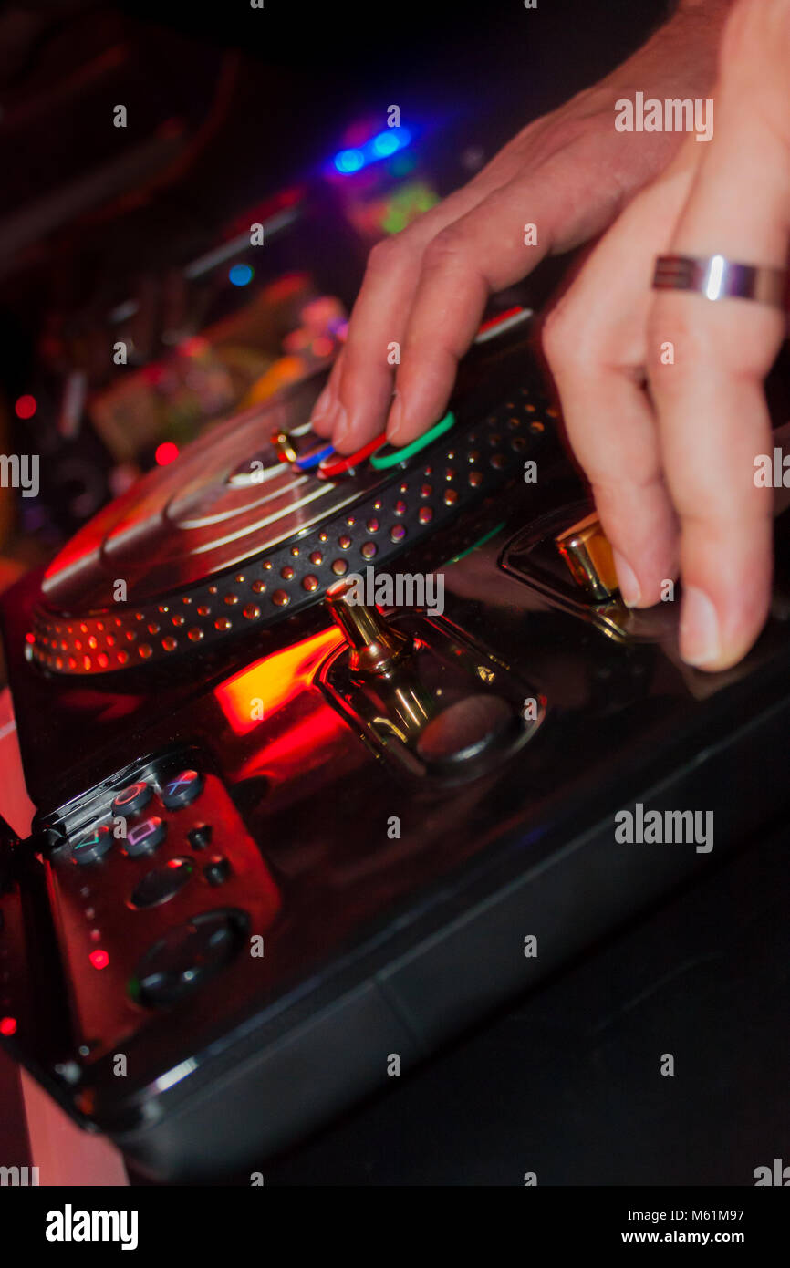 Male hands playing dj with toy turntable of console on a party Stock ...