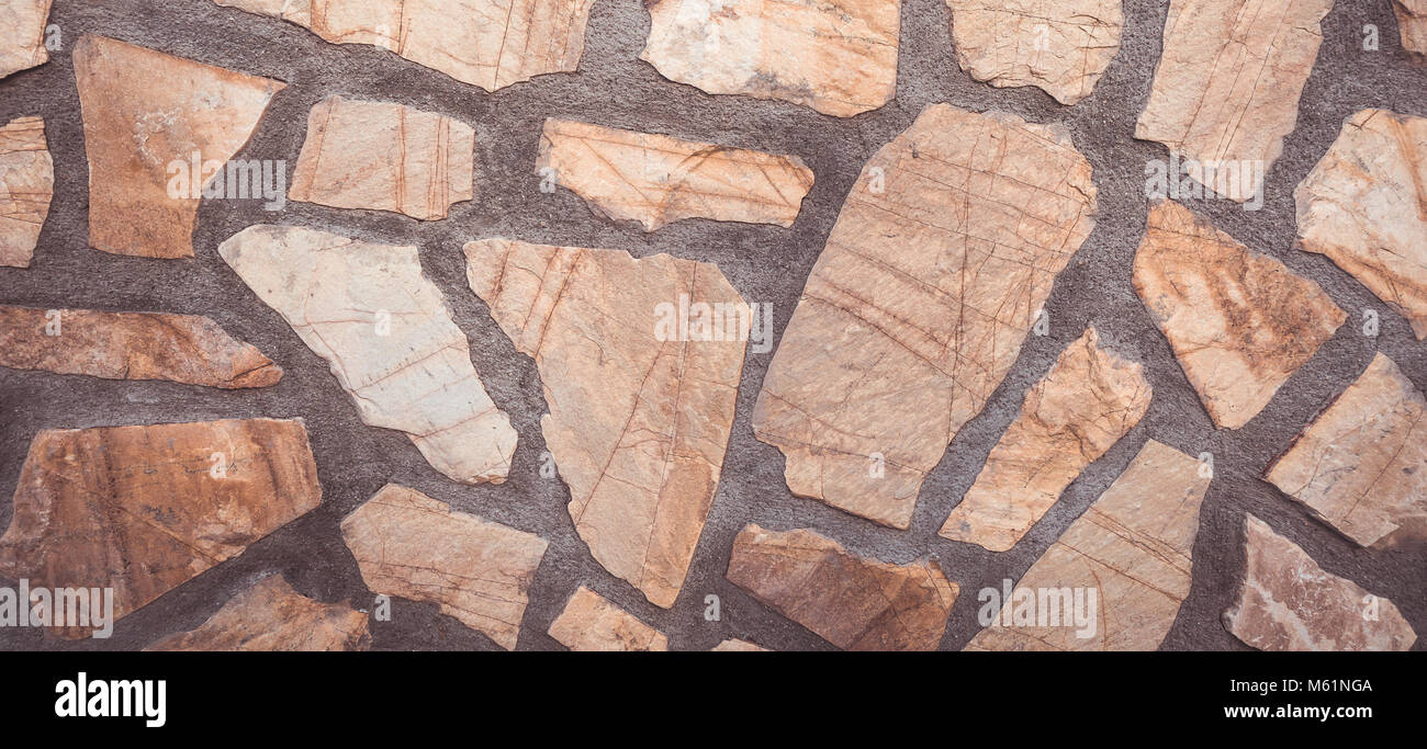 Masonry wall of stones with irregular pattern texture background Stock ...