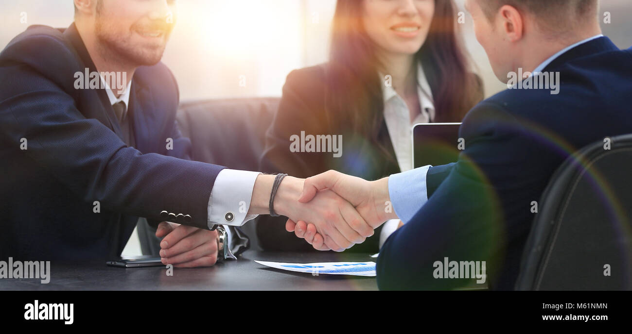 concept of cooperation and partnership. handshake financial partners ...