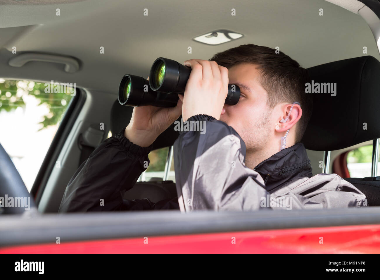 Sitting man binocular hi-res stock photography and images - Alamy