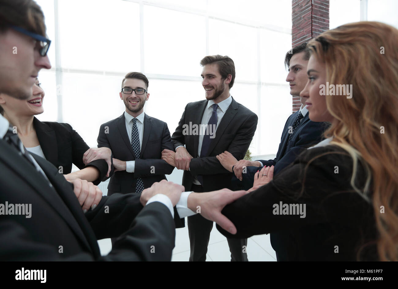 closeup. business team showing their unity Stock Photo - Alamy