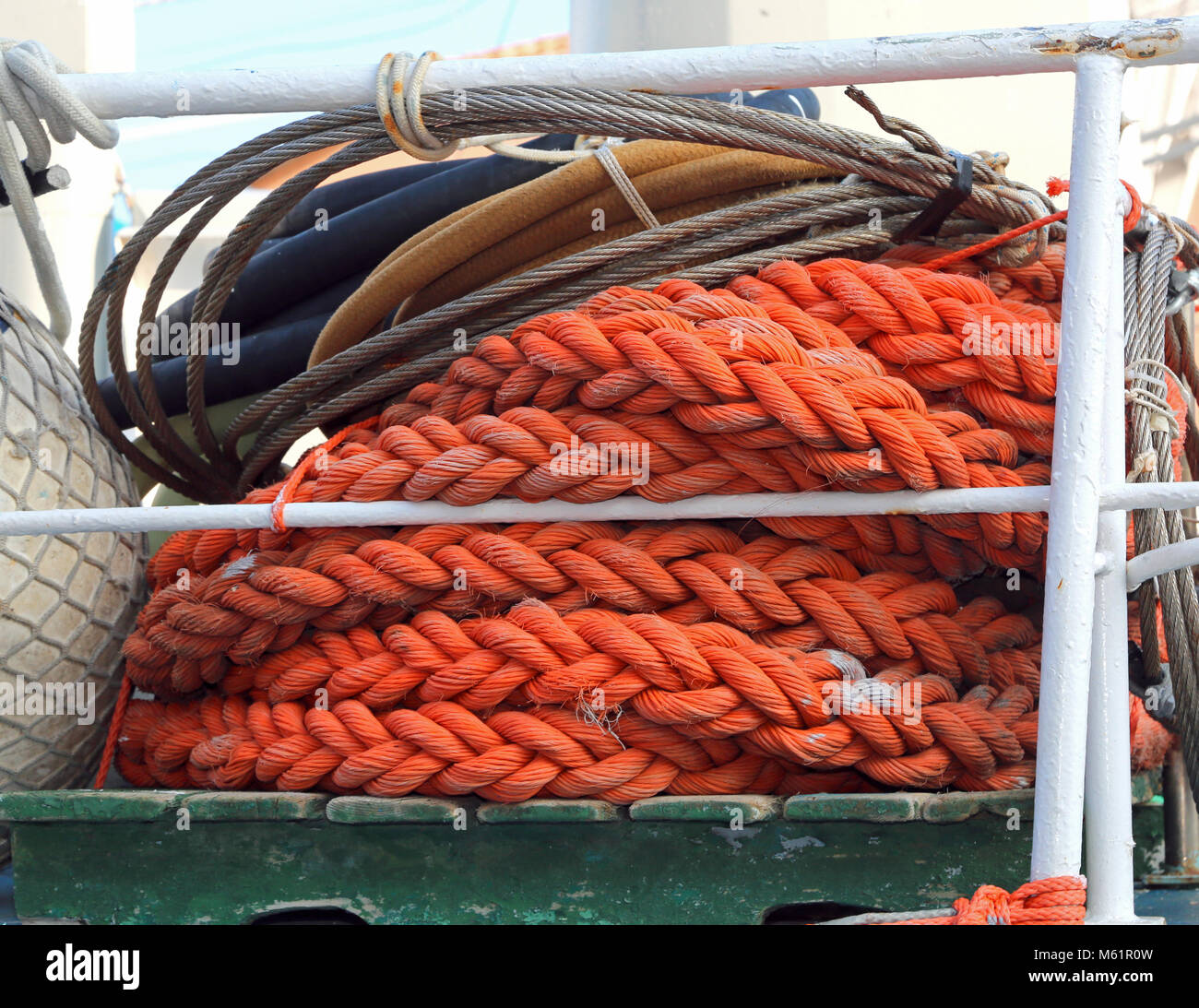 detail of big orange rope in the fishing boat Stock Photo - Alamy